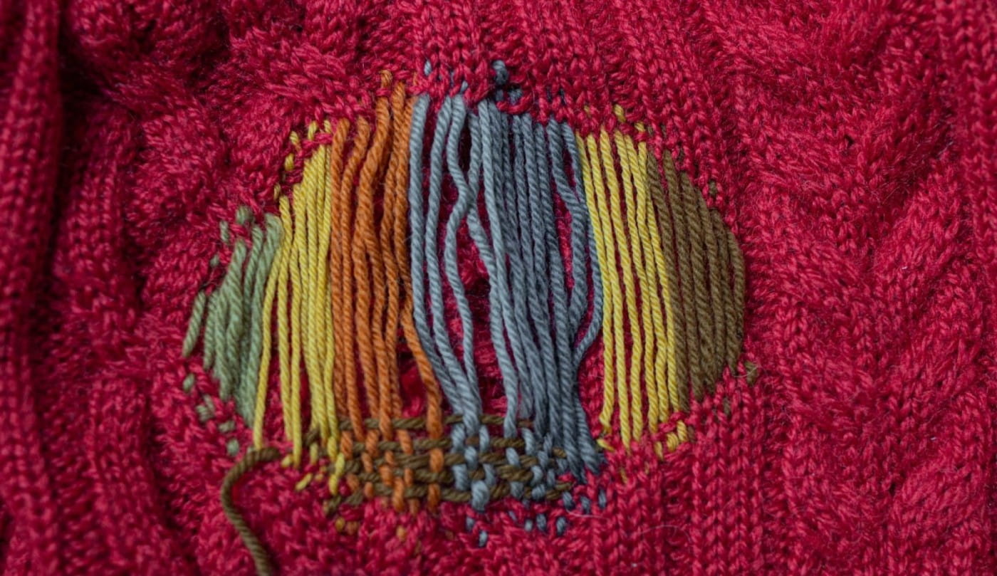Visible mending on a knitted jumper | Snapdragon Life